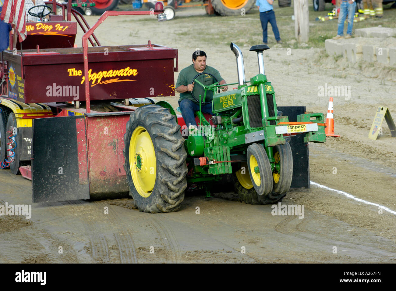 Farmer participates in a tractor pull contest Stock Photo - Alamy