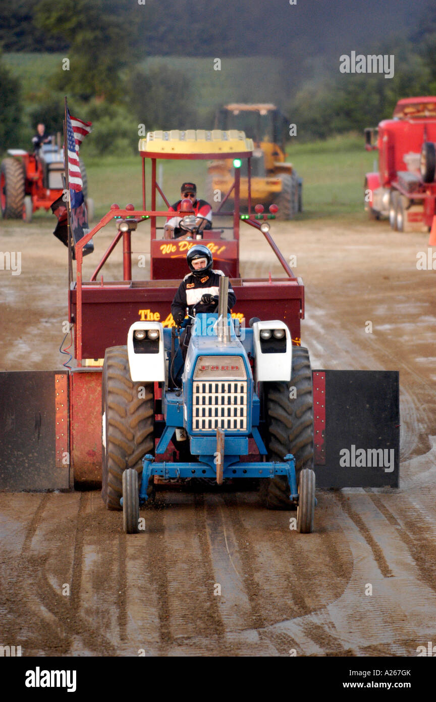 Farmer participates in a tractor pull contest Stock Photo - Alamy