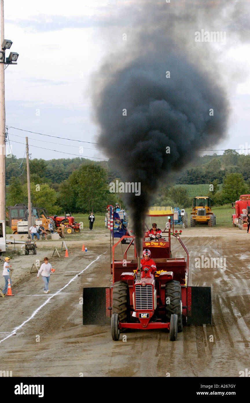 Farmer participates in a tractor pull contest Stock Photo - Alamy
