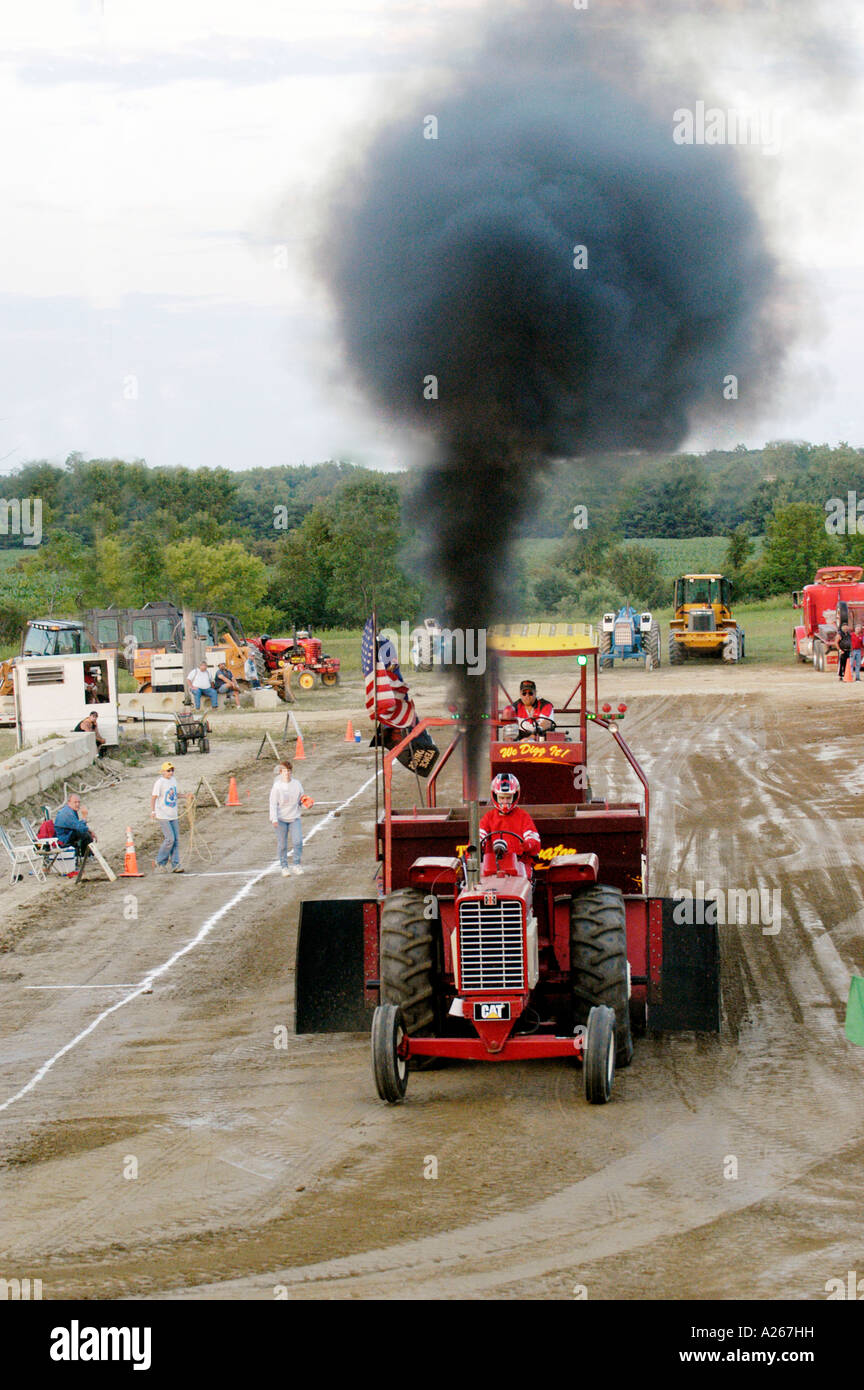 Farmer participates in a tractor pull contest Stock Photo - Alamy