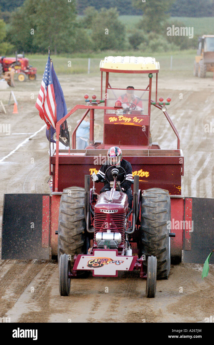Farmer participates in a tractor pull contest Stock Photo - Alamy