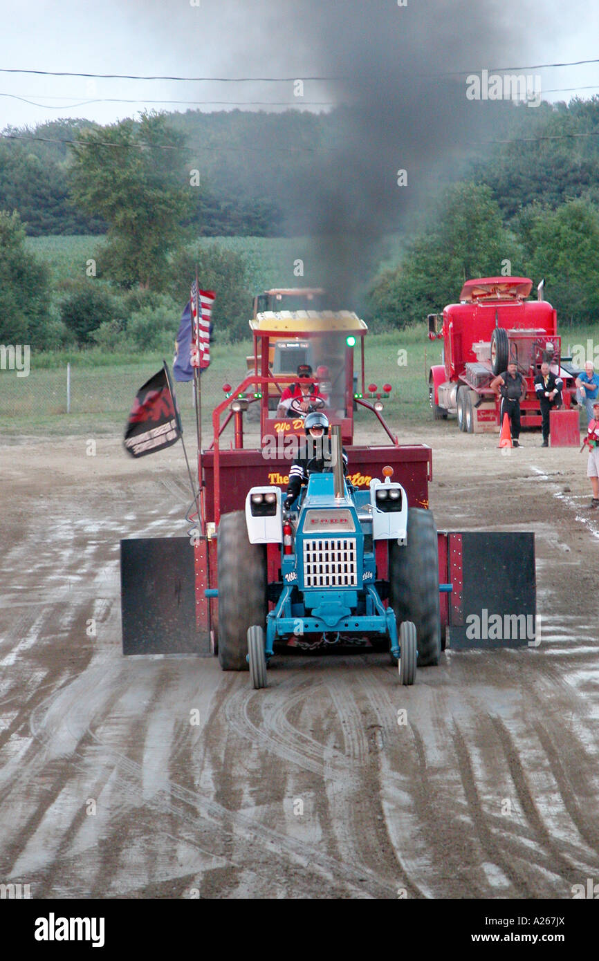Farmer participates in a tractor pull contest Stock Photo - Alamy