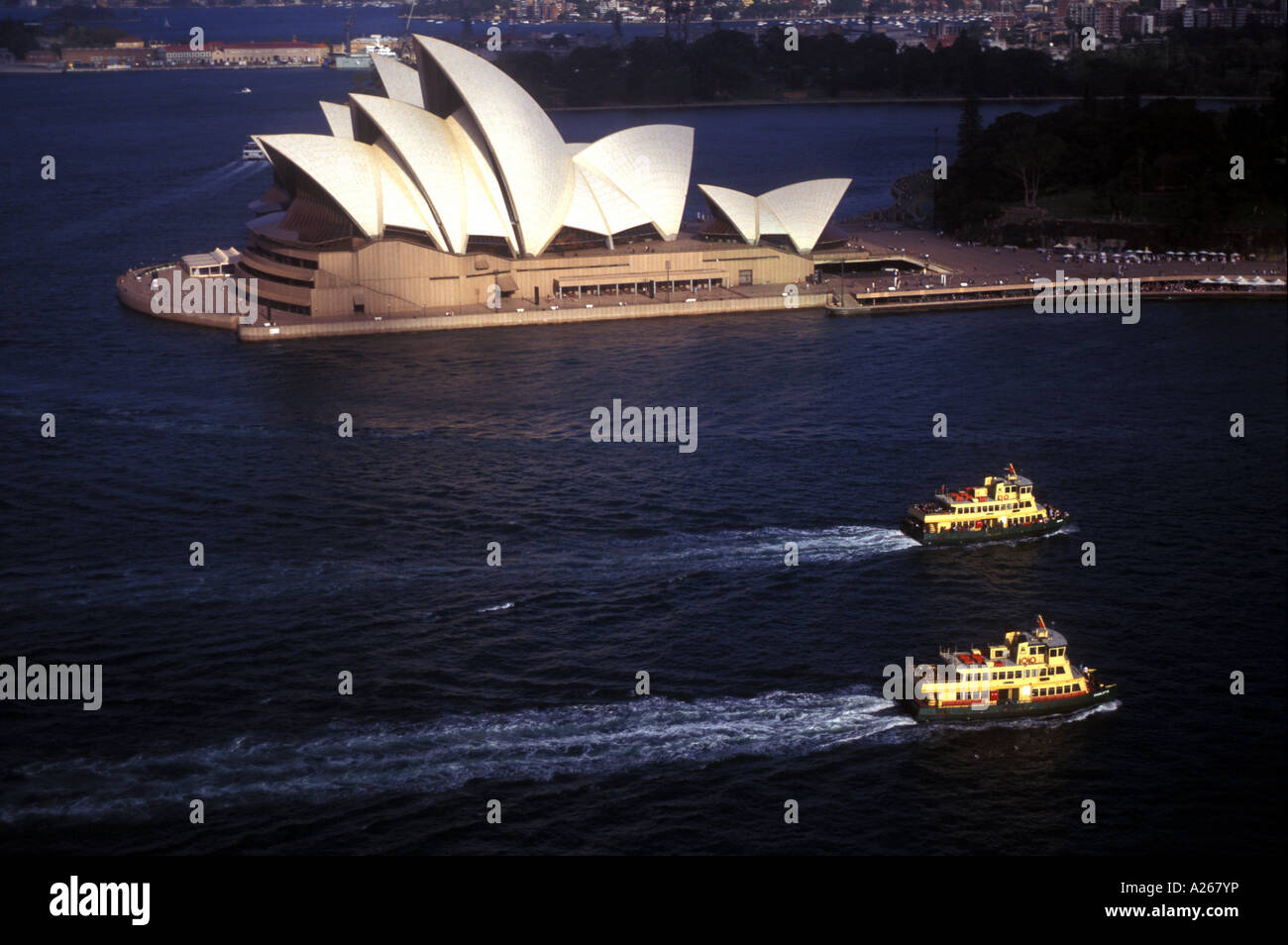 Sydney Opera House from the Harbour Bridge. Two ferries serving outer ...