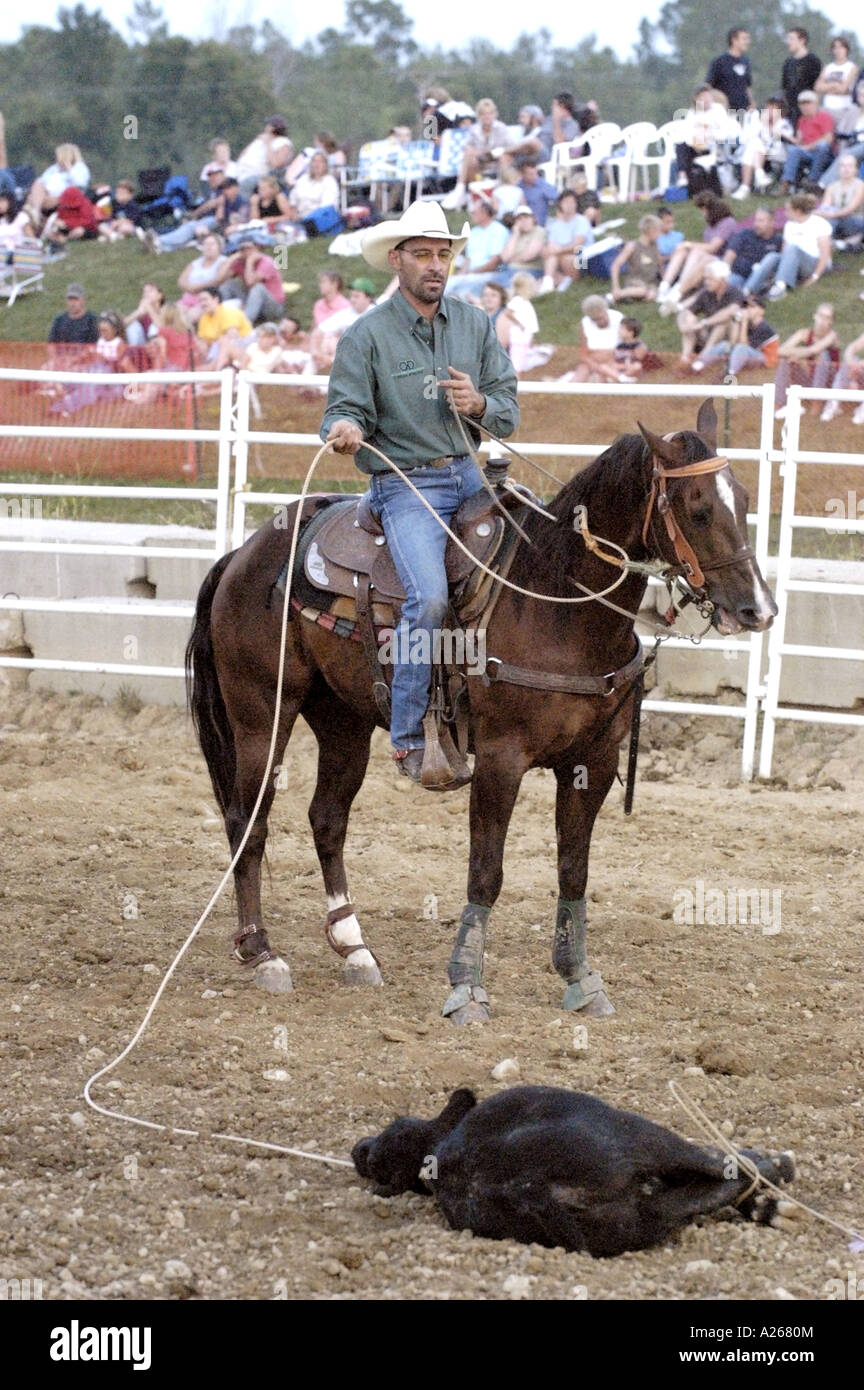 Cowboys compete in Rodeo action Stock Photo - Alamy
