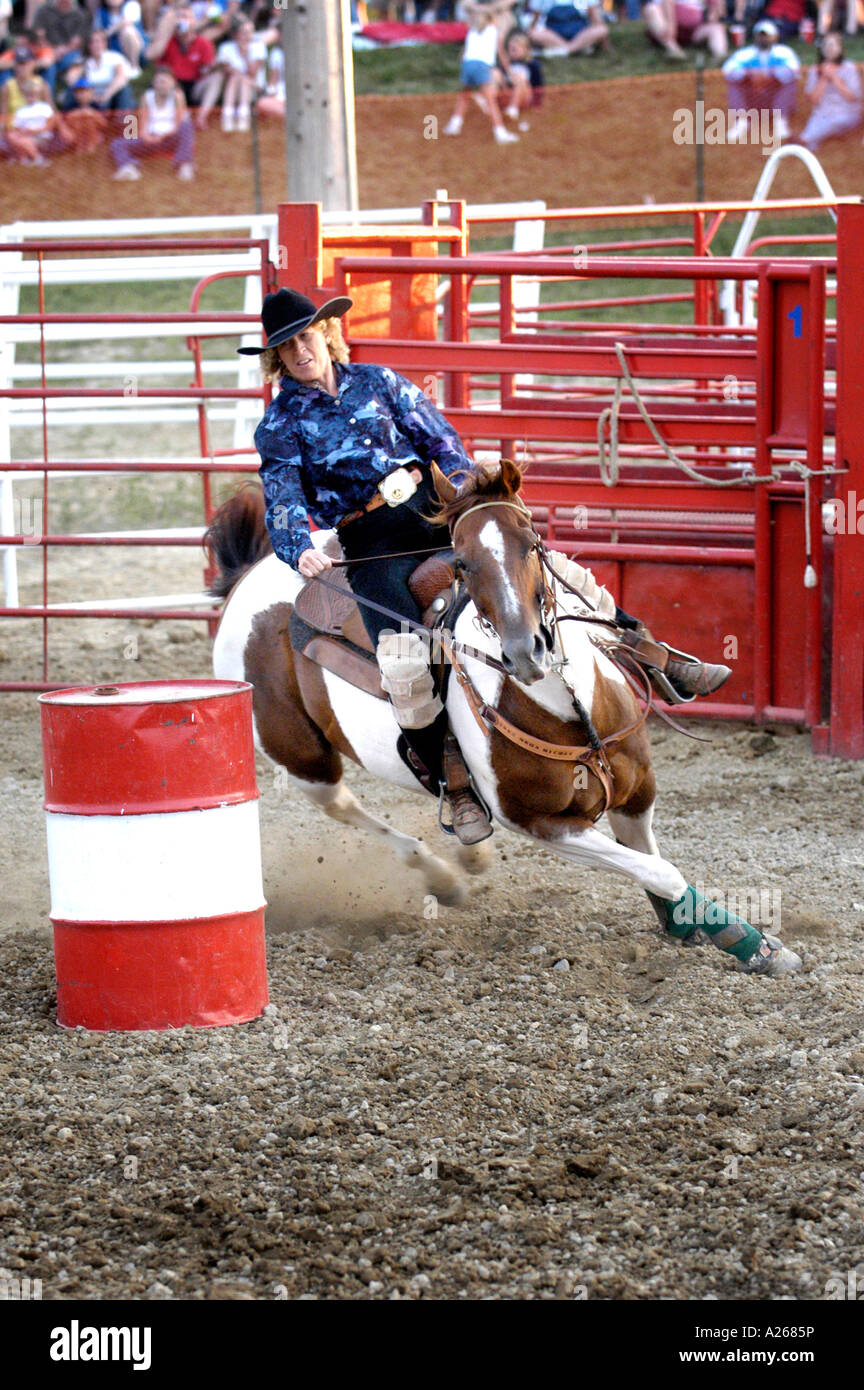 Female cowboy Compete in Rodeo Barrel Competition Stock Photo - Alamy