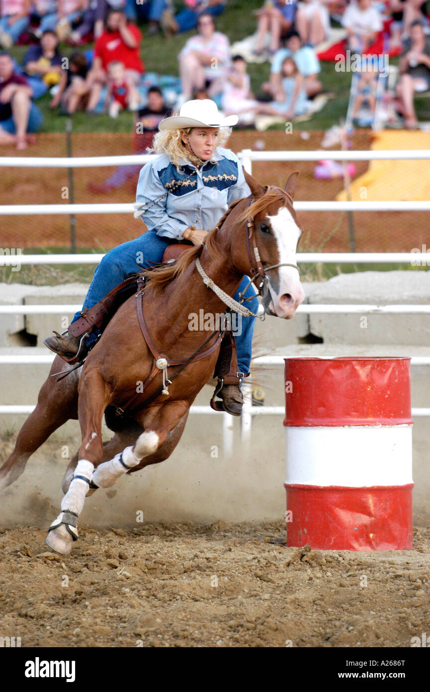 Female cowboy Compete in Rodeo Barrel Competition Stock Photo - Alamy