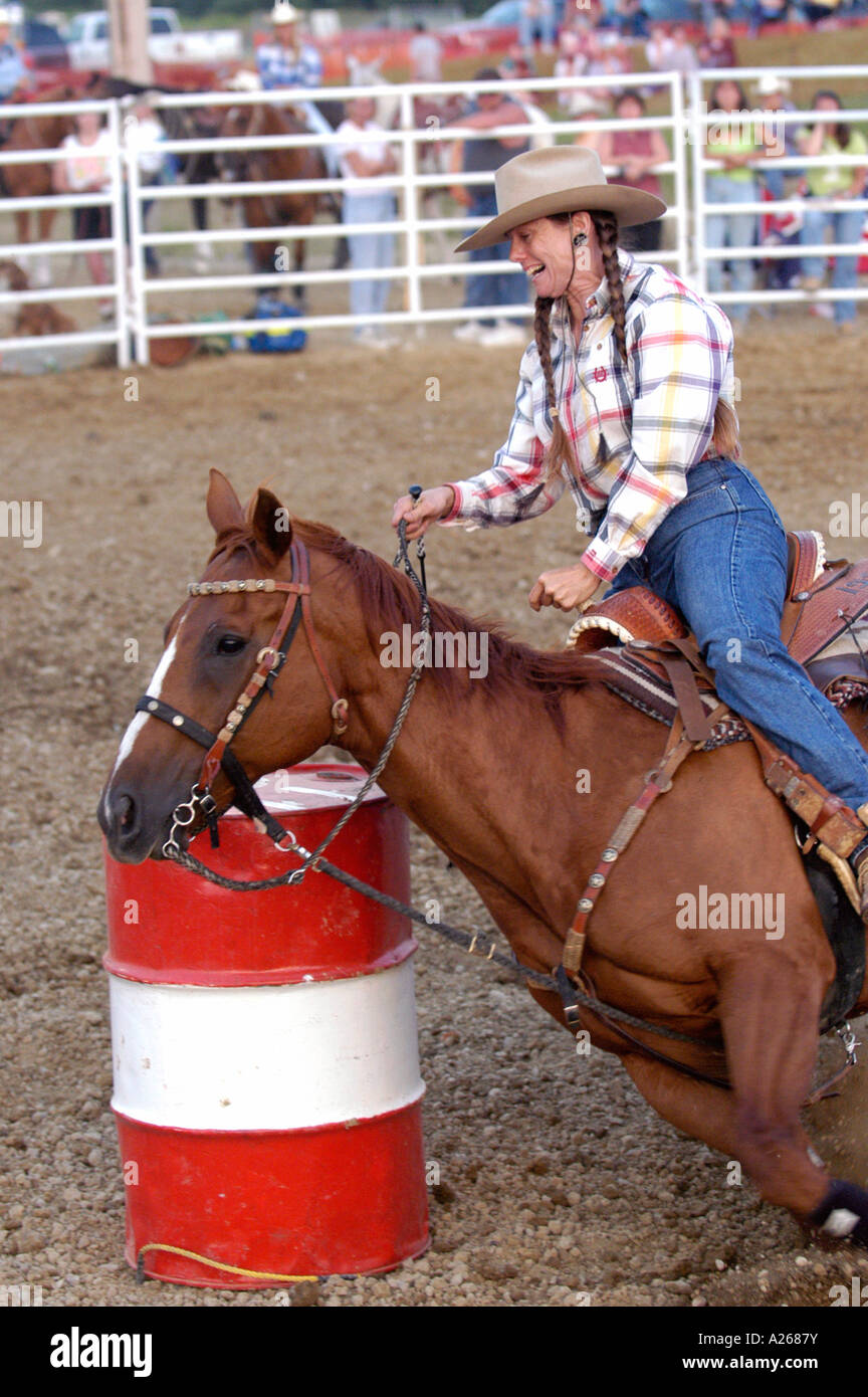Female cowboy Compete in Rodeo Barrel Competition Stock Photo - Alamy