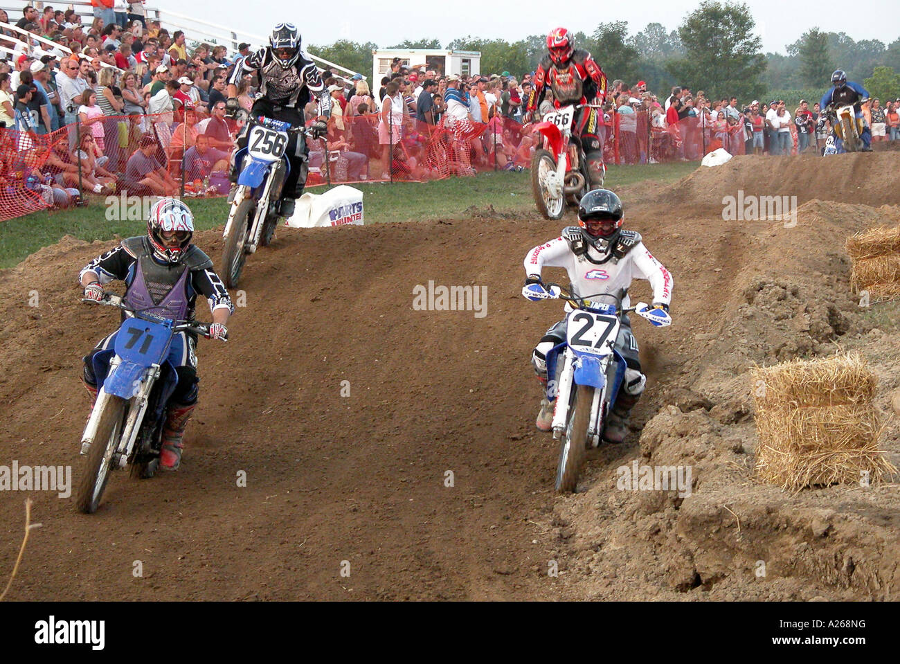 Colorful motorcyclist participate in a motocross bike race Stock Photo ...