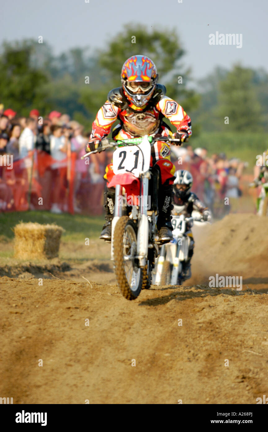 Colorful motorcyclist participate in a motocross bike race Stock Photo ...