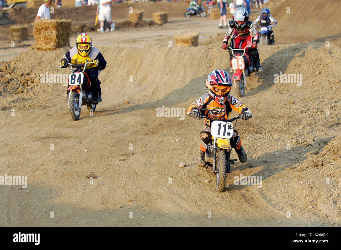 Colorful motorcyclist participate in a motocross bike race Stock Photo ...