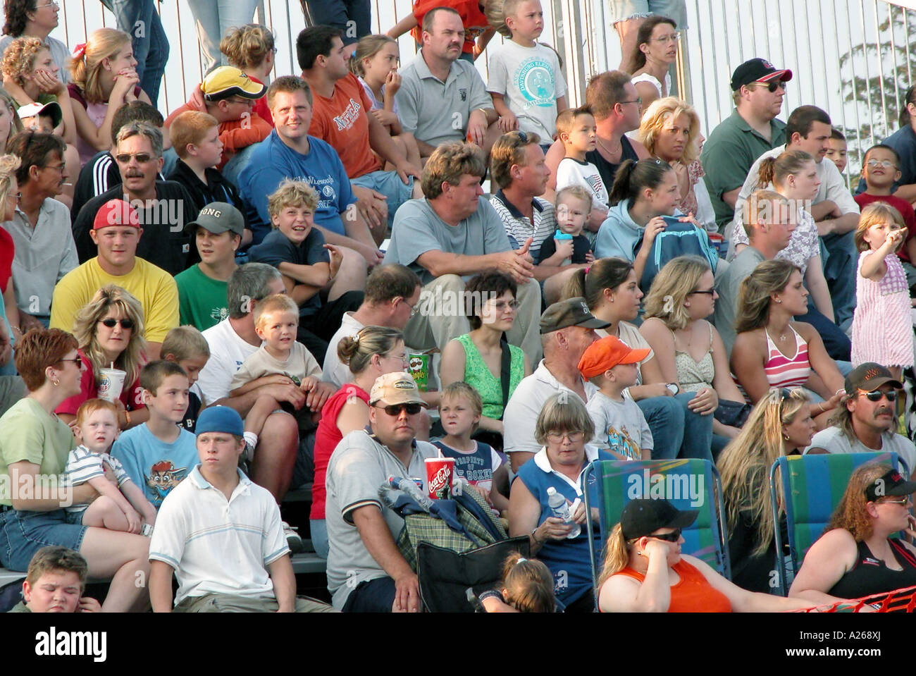 crowds of people watch a motorcycle racing event Stock Photo - Alamy