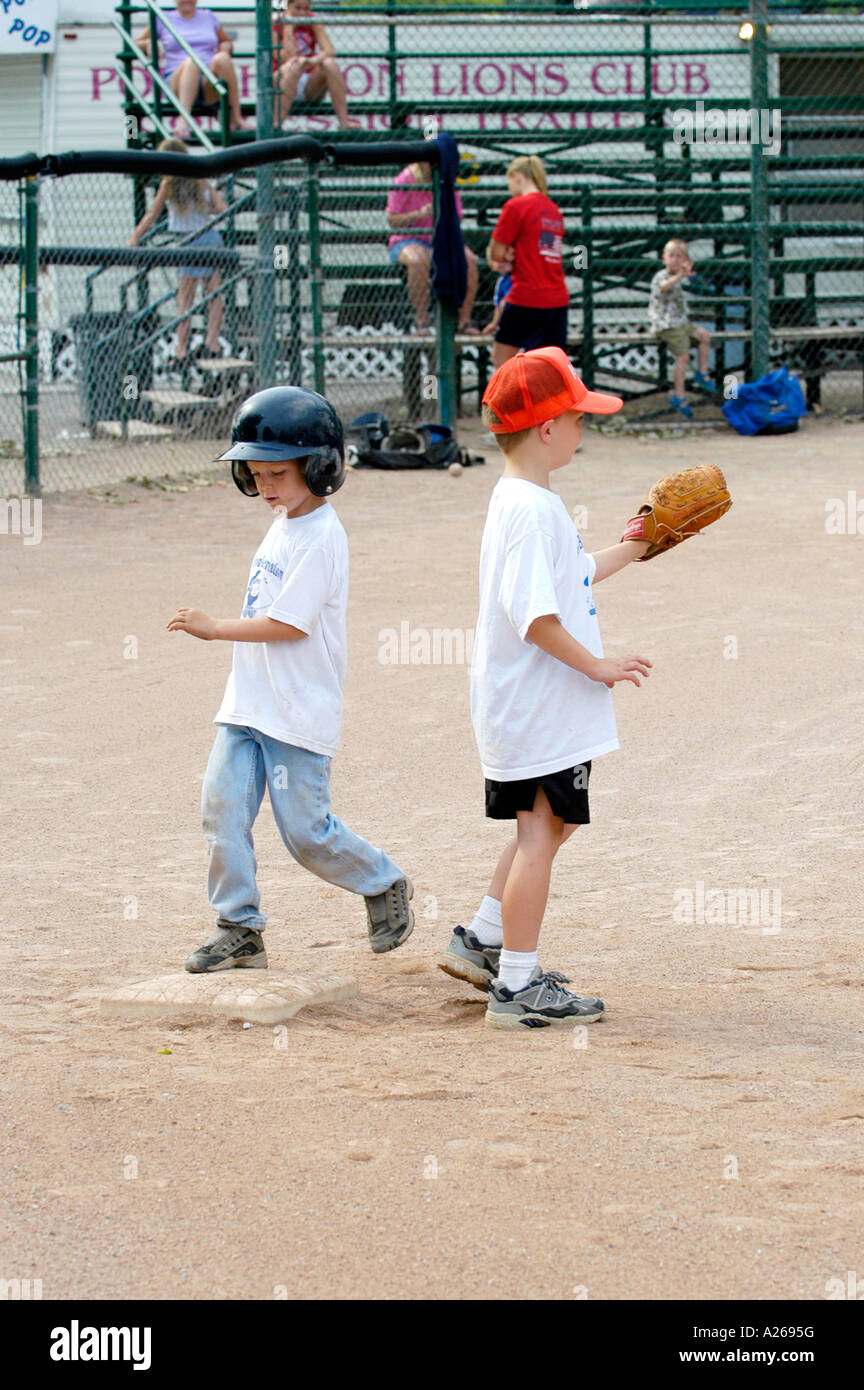 5 to 7 year old boys and girls taken baseball lessons by being ...