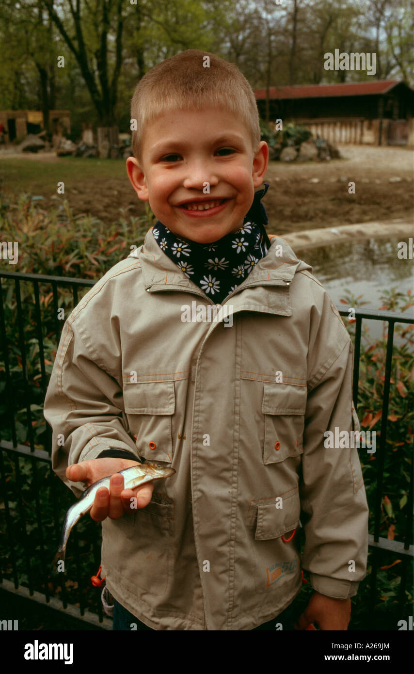 Boy with fish Stock Photo - Alamy