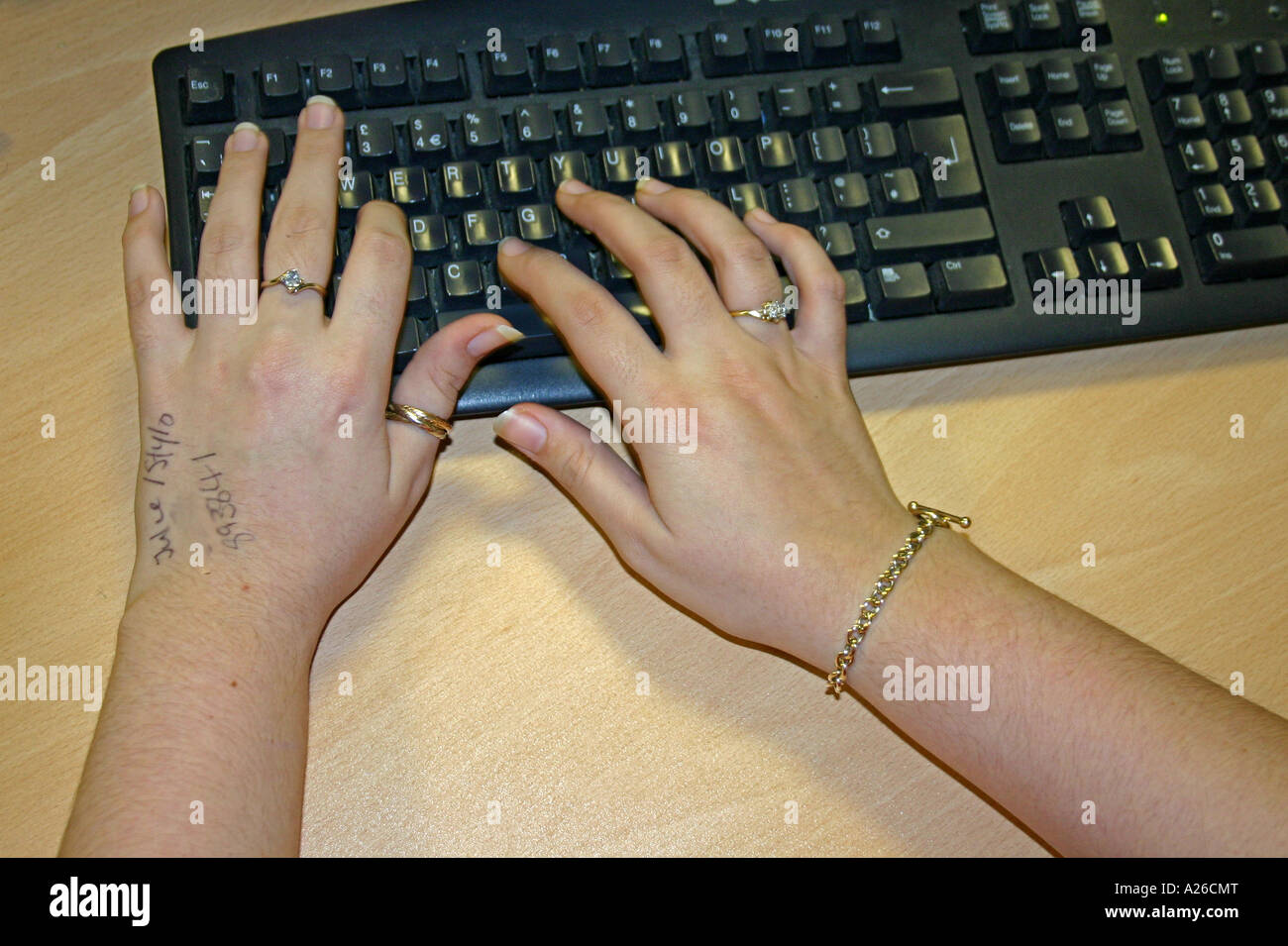 hands typing on keyboard Stock Photo - Alamy