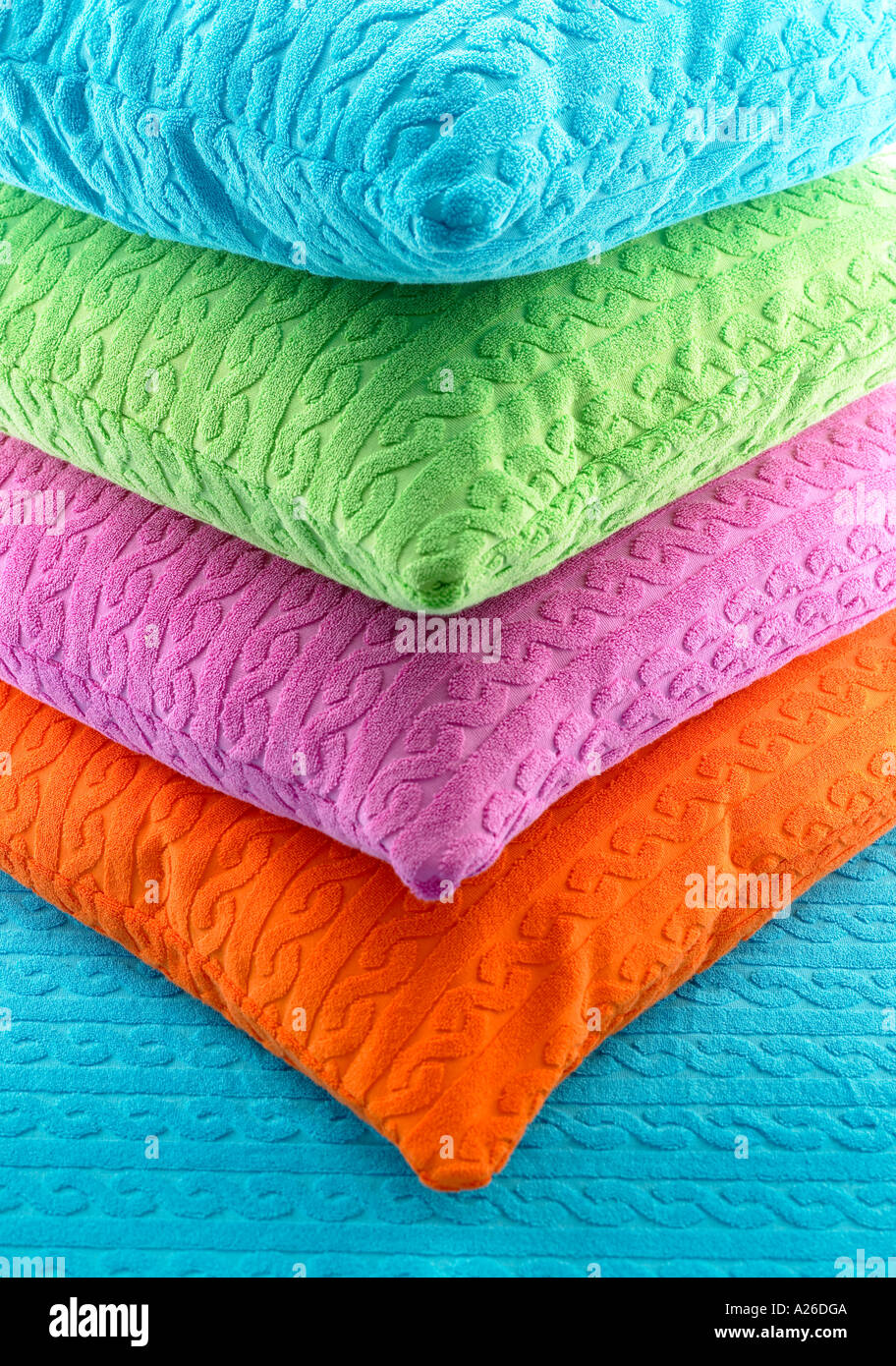 Multi colored cushion stack Stock Photo - Alamy