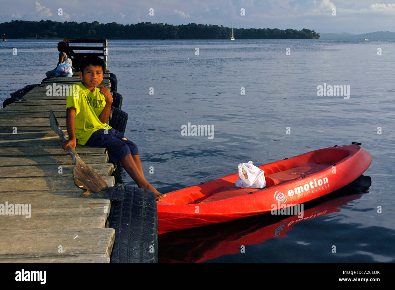 Guaymi boy with plastic sea kayak, Bastimentos Island, Bocas del Toro ...