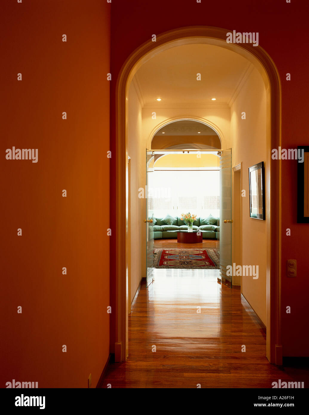 View of a hallway leading to a living room Stock Photo - Alamy