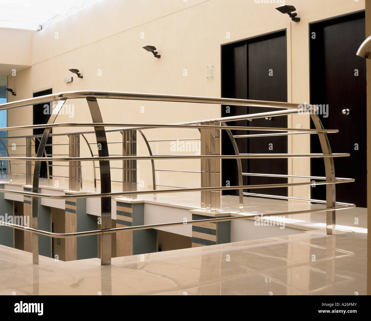 View of railings surrounding an atrium of a building Stock Photo - Alamy