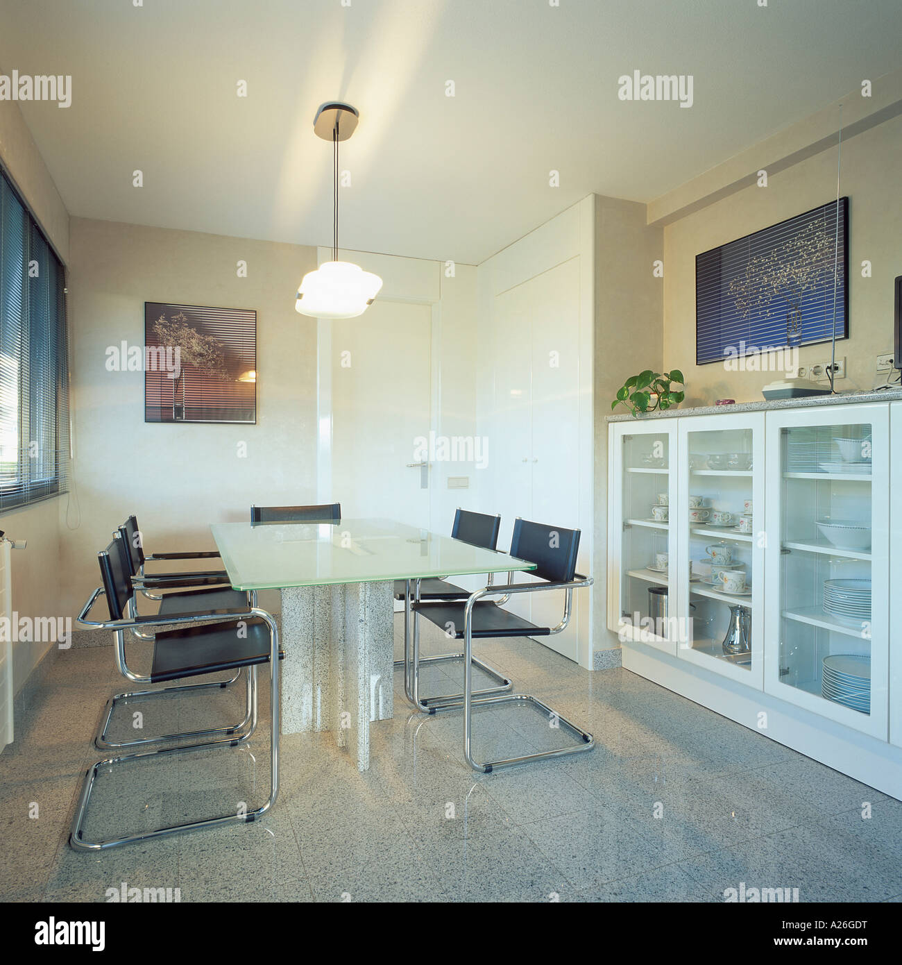 View of a lamp lighting up a dining table Stock Photo - Alamy