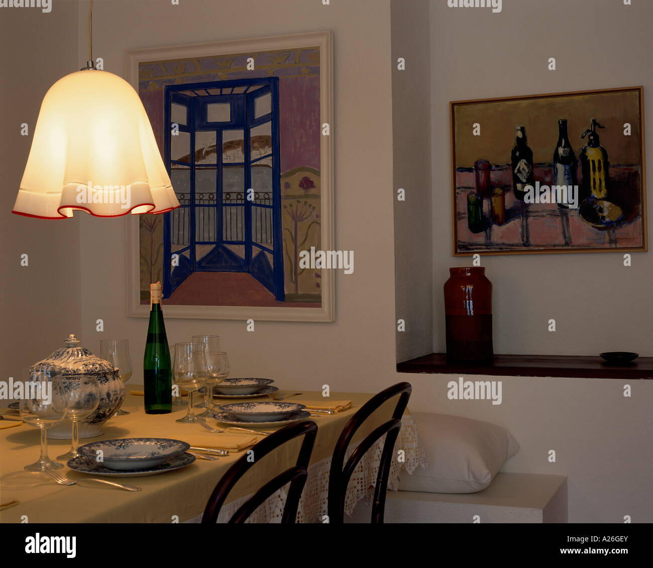 View of a lamp illuminating a dining table Stock Photo - Alamy
