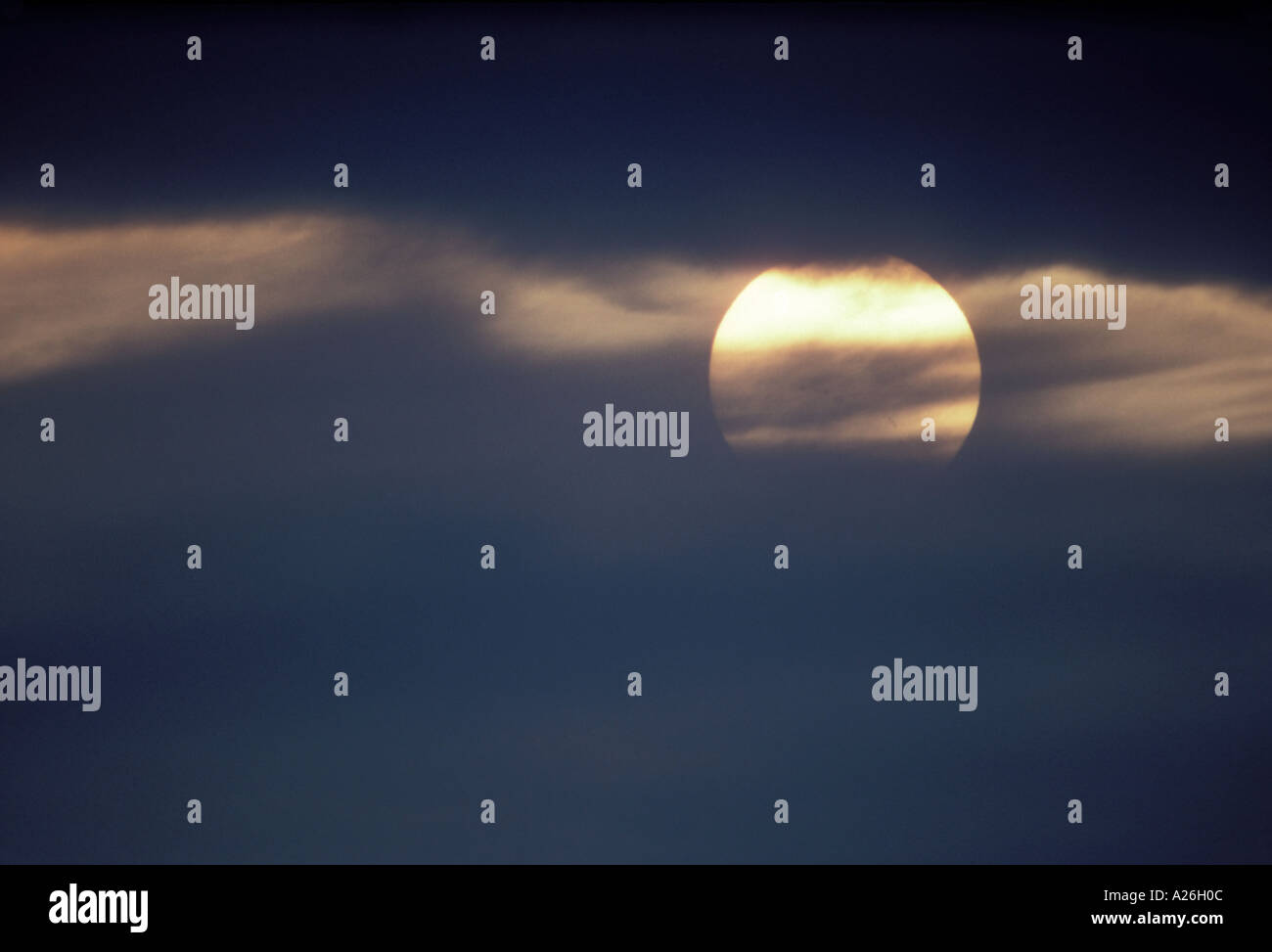 Sun between layers clouds hi-res stock photography and images - Alamy