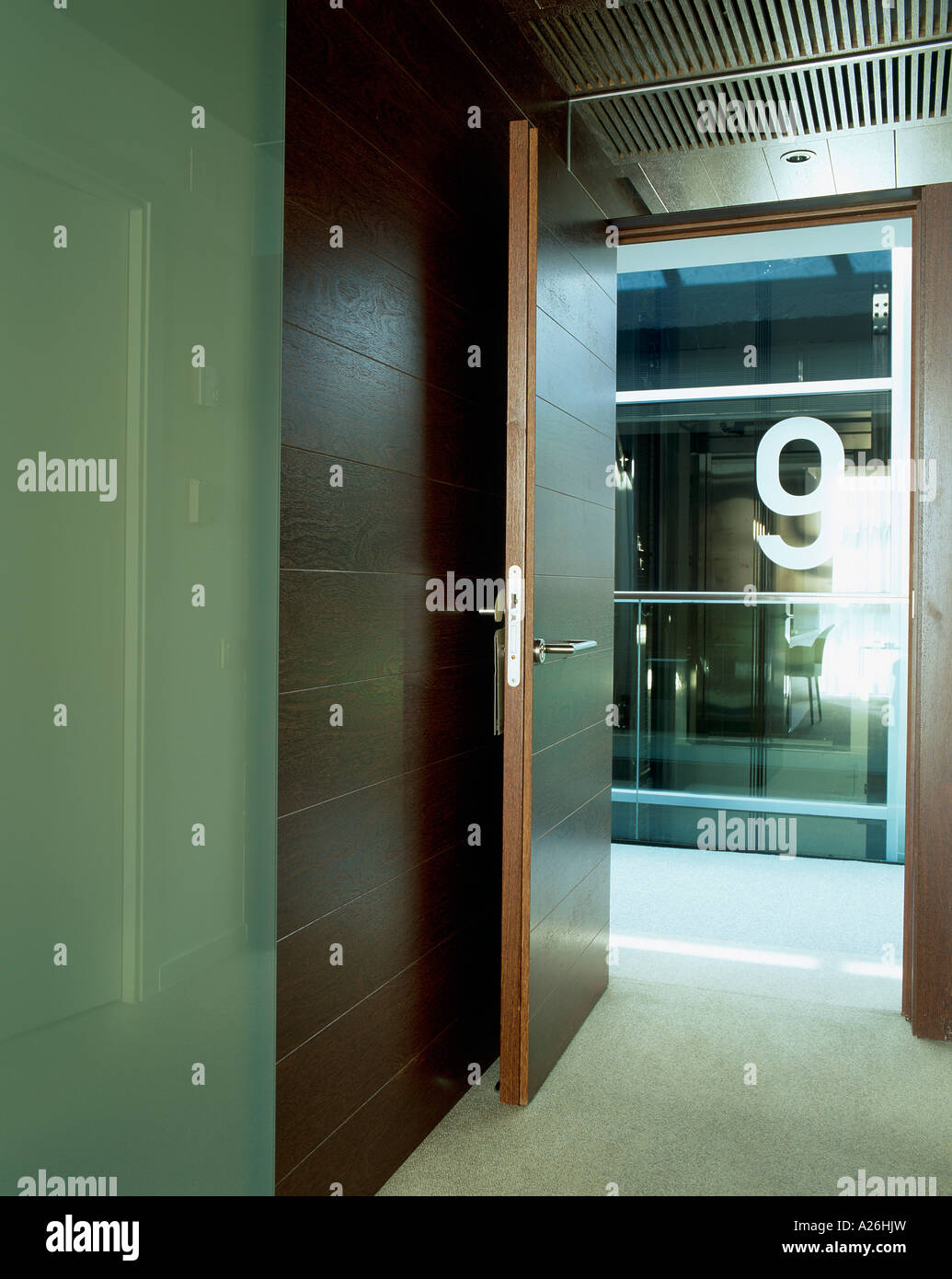 View of a doorway inside an office building Stock Photo - Alamy