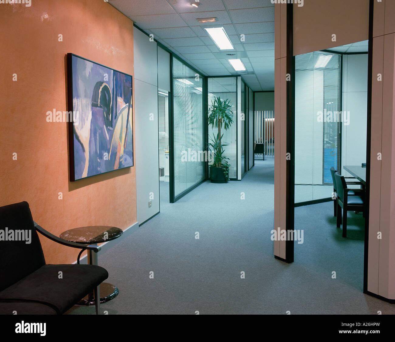 View of an eclectic hallway inside an office building Stock Photo - Alamy