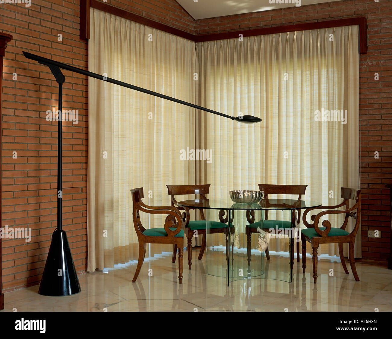 View of a lamp beside a dining table Stock Photo - Alamy