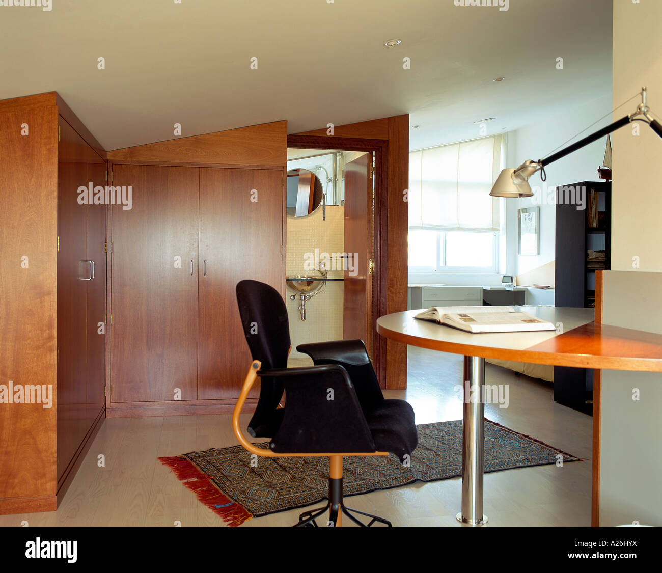 View of a chair placed near a table Stock Photo - Alamy