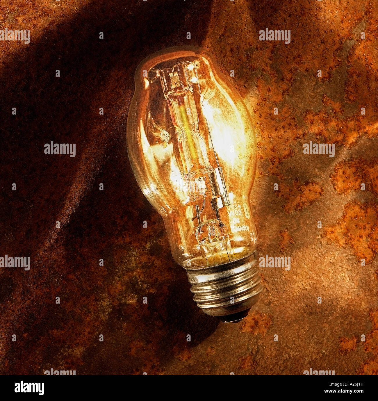 Light Bulb on a bent metal Rusty Surface Stock Photo - Alamy