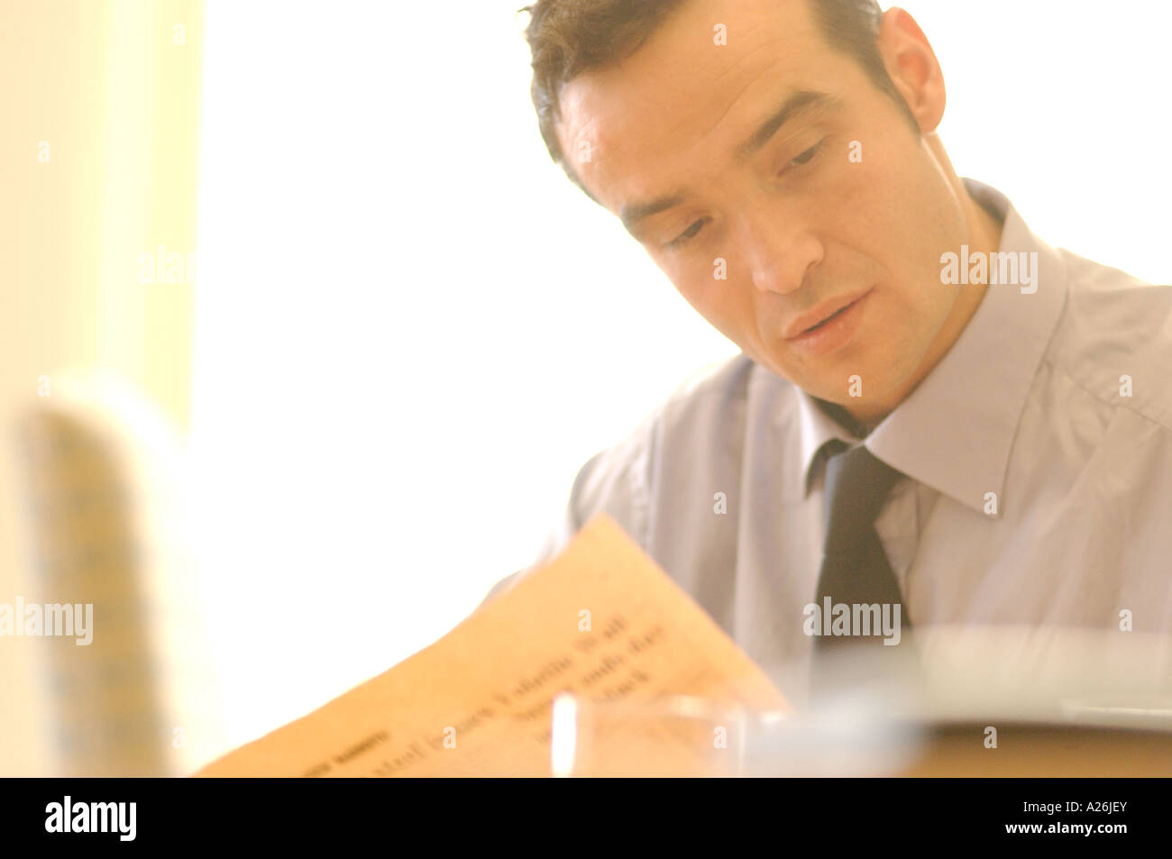 British business man reading the UK financial times Stock Photo - Alamy