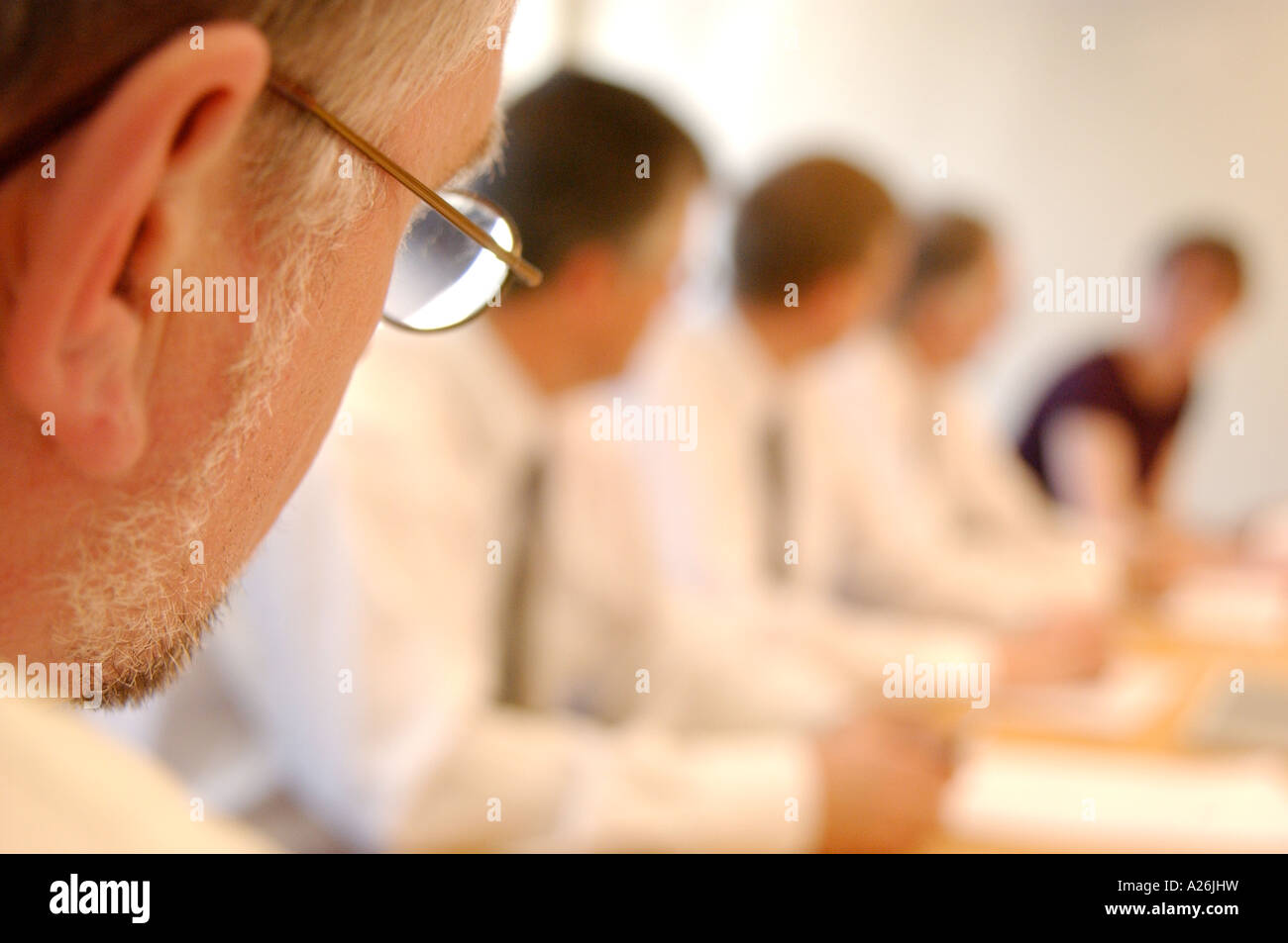 Royalty free photograph of close up of business man looking at out of ...