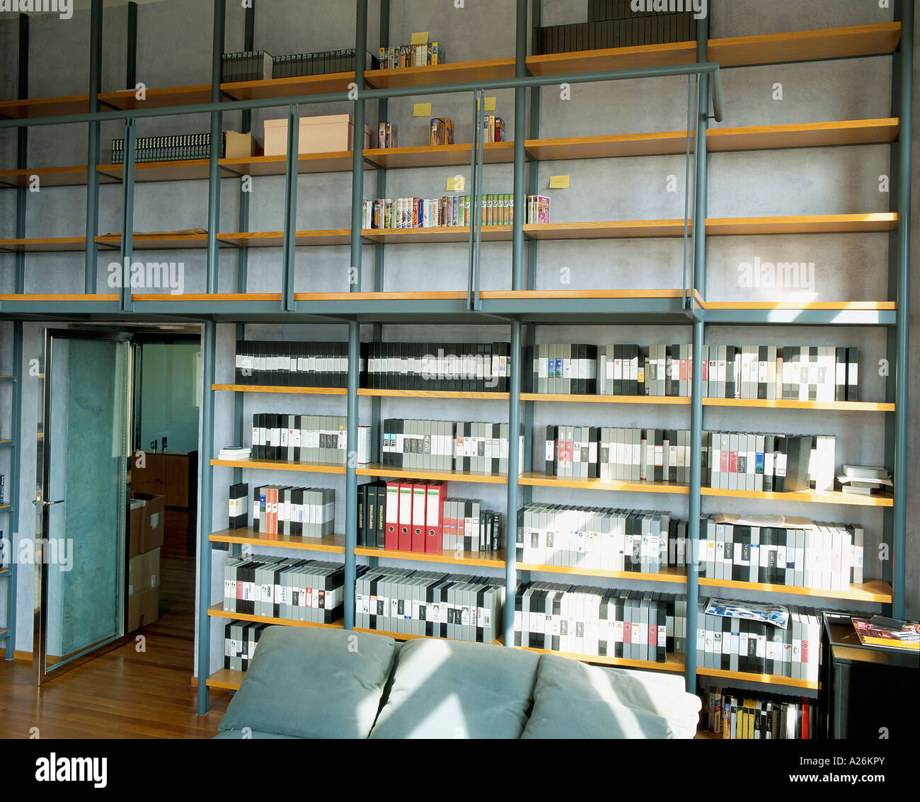View of bookshelves in a library Stock Photo - Alamy