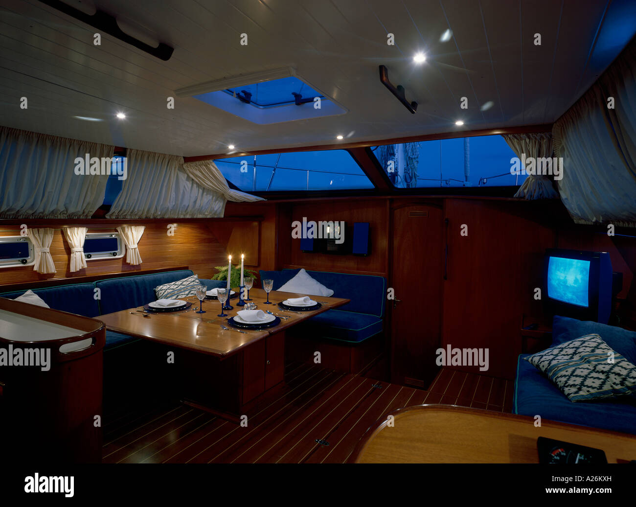 View of a table set for meal on a ship Stock Photo - Alamy