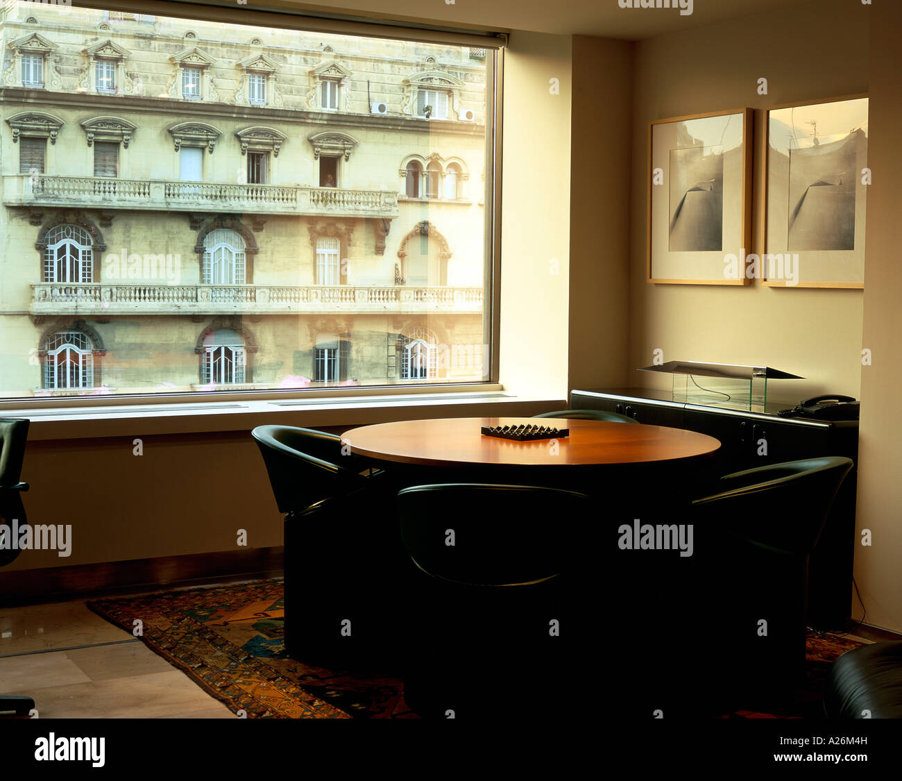 View of an office set with a round table and chairs Stock Photo - Alamy