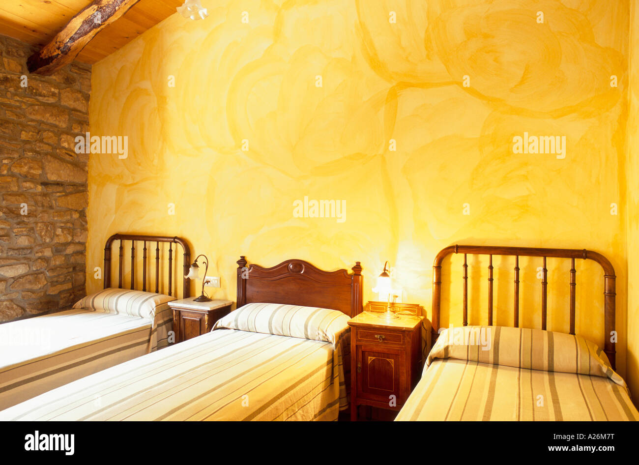 View of three single beds in a bedroom Stock Photo - Alamy