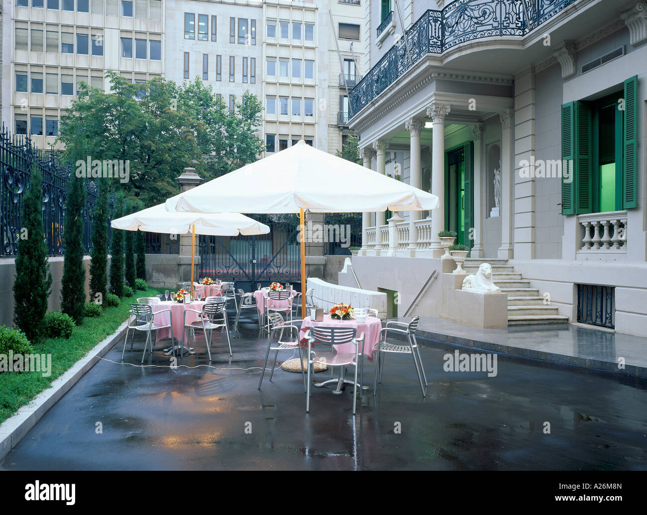 View of dining tables set under the canopies outside a hotel Stock ...