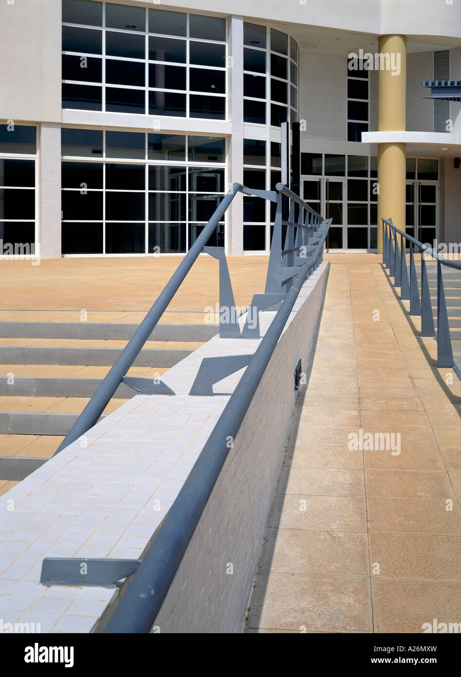 View of a passageway leading to an office building Stock Photo - Alamy