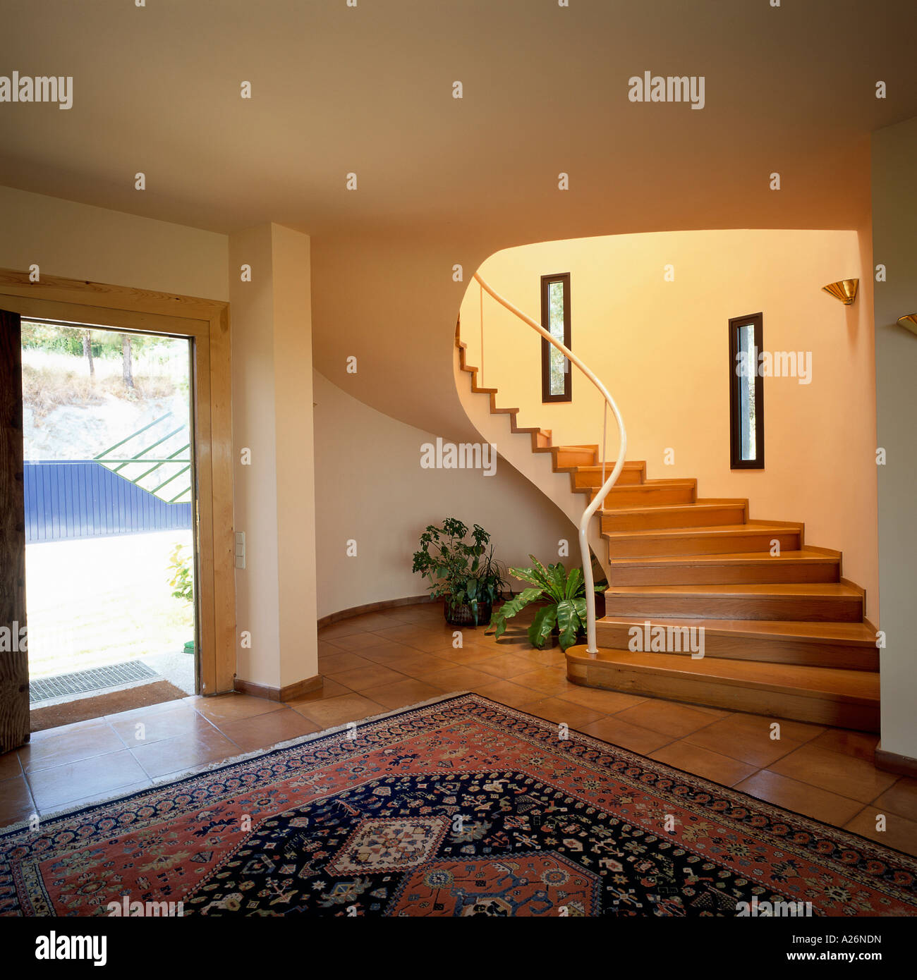 View of a winding stairway in an eclectic house Stock Photo - Alamy