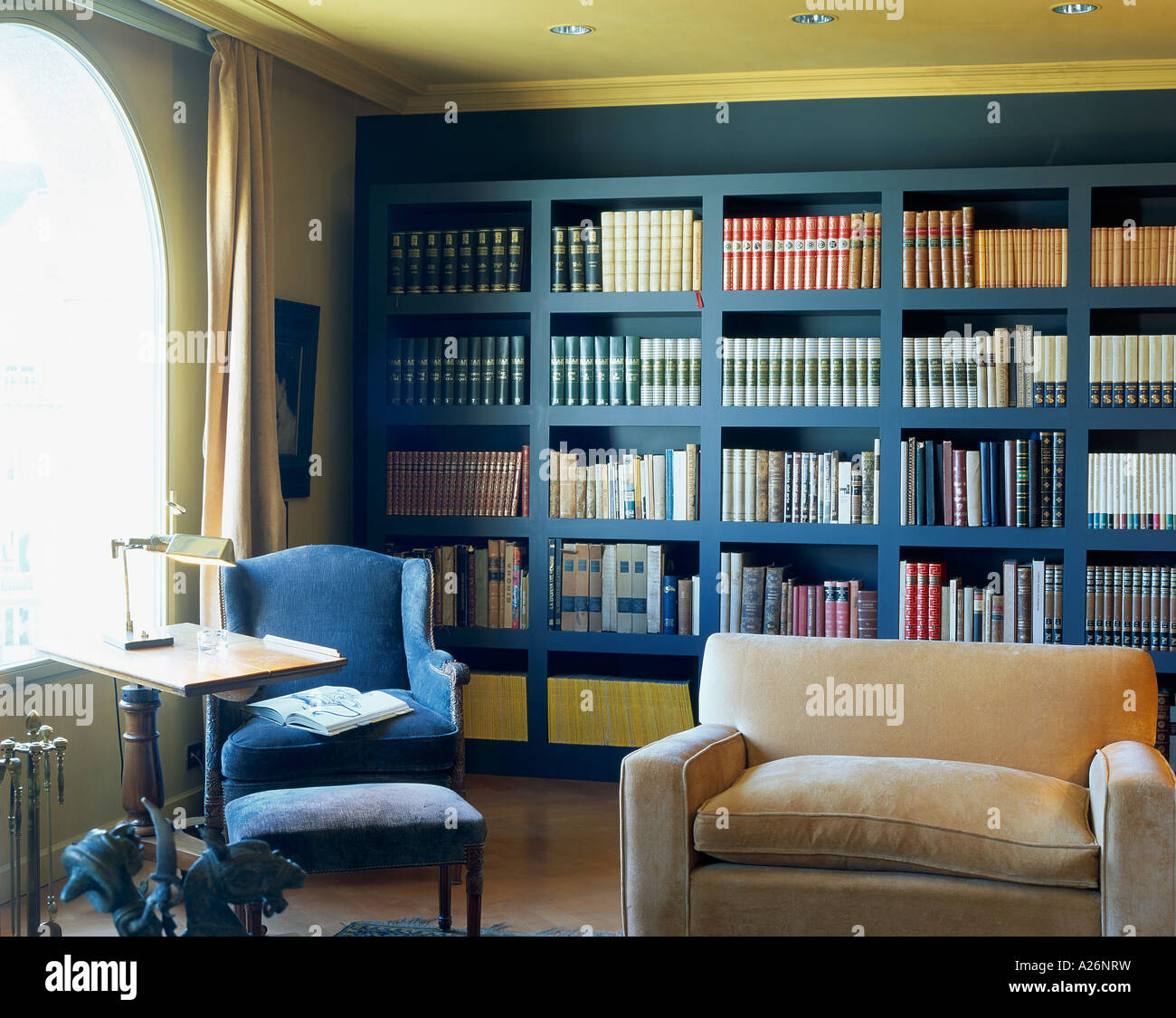 View of a well arranged bookshelf in a home library Stock Photo - Alamy