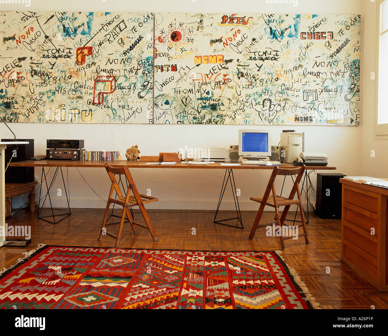 Graffiti displayed above a study table Stock Photo - Alamy