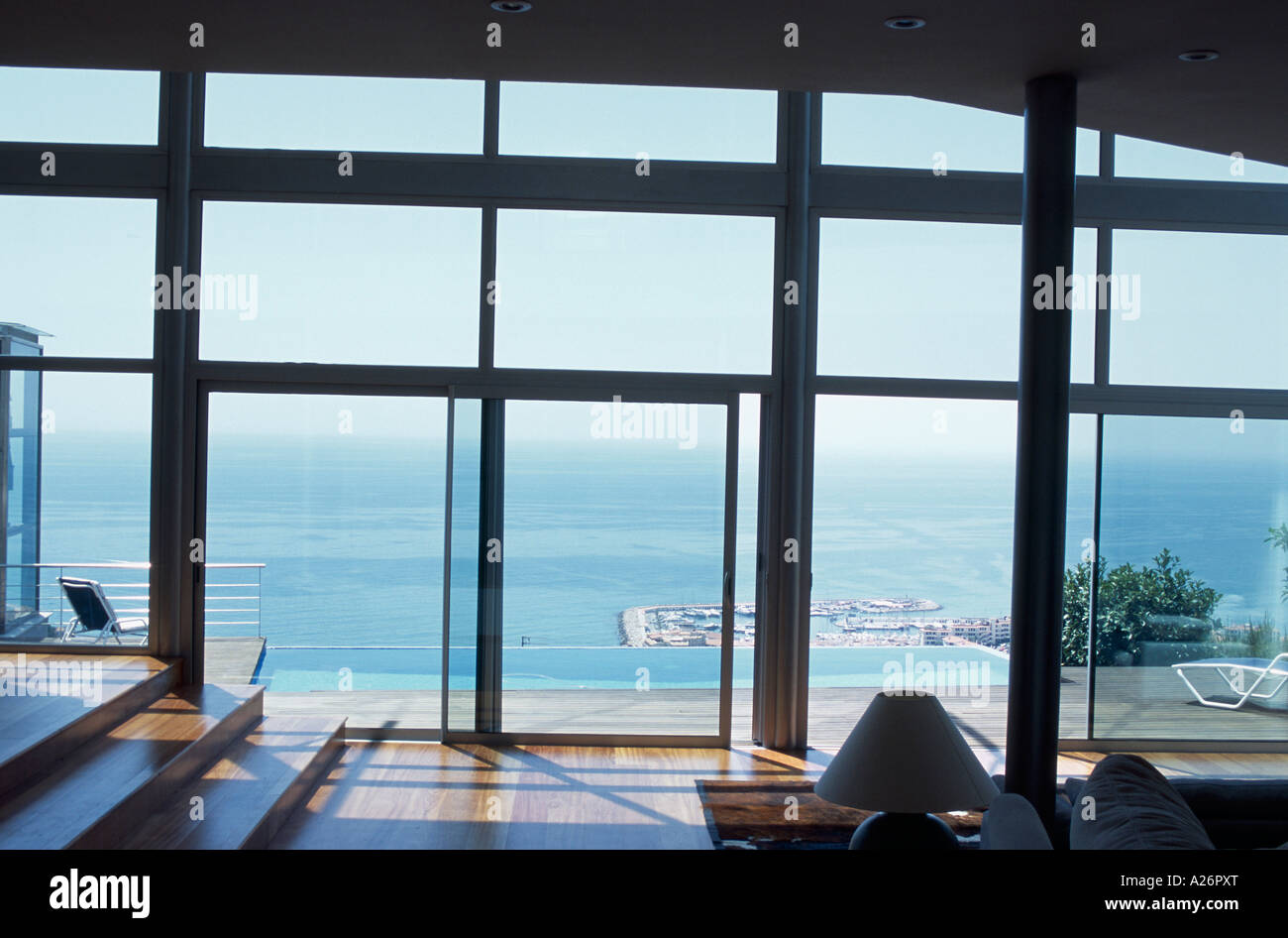 View of the sea from an eclectic room Stock Photo - Alamy