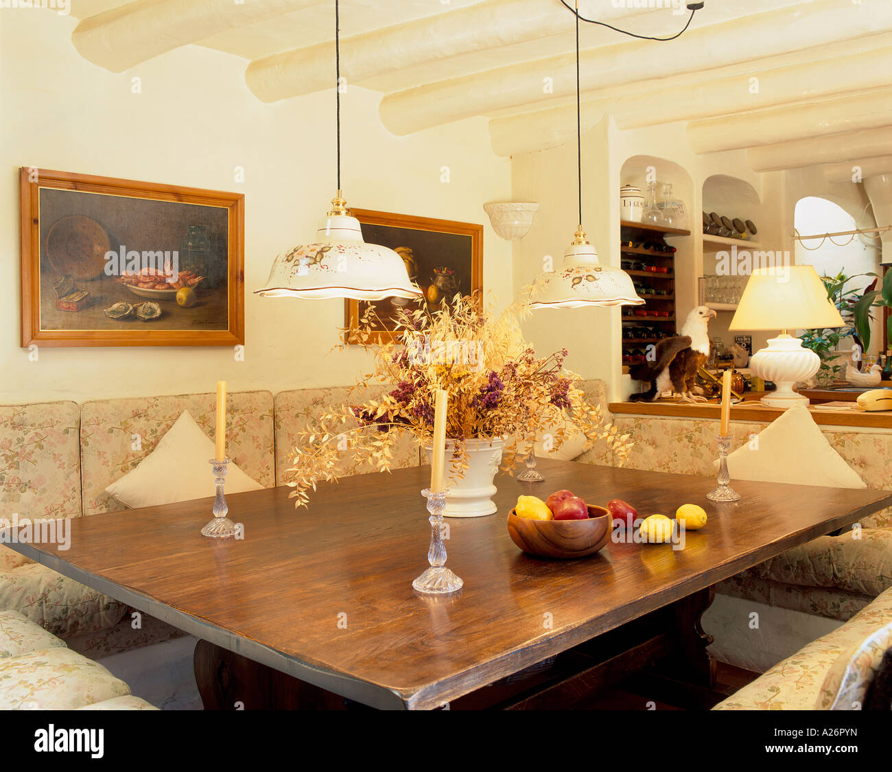 View of lamps over a wooden dining table Stock Photo - Alamy