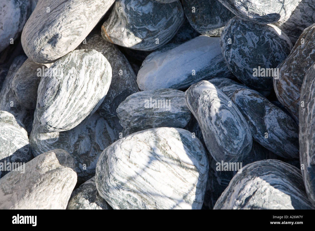 Background texture large smooth grey pebbles Stock Photo - Alamy