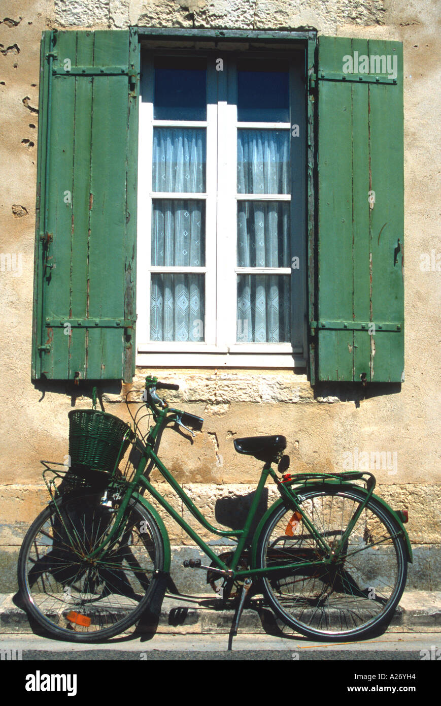 Bike cycle bicycle leaning underneath a window in port of St Martin L ...