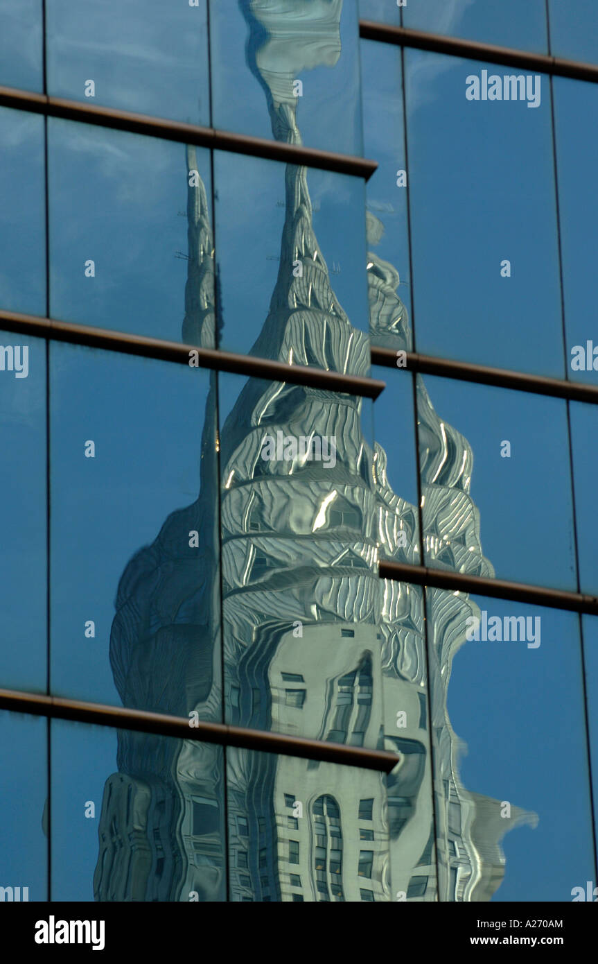 The Chrysler Building skyscraper reflected in the glass of another tall ...
