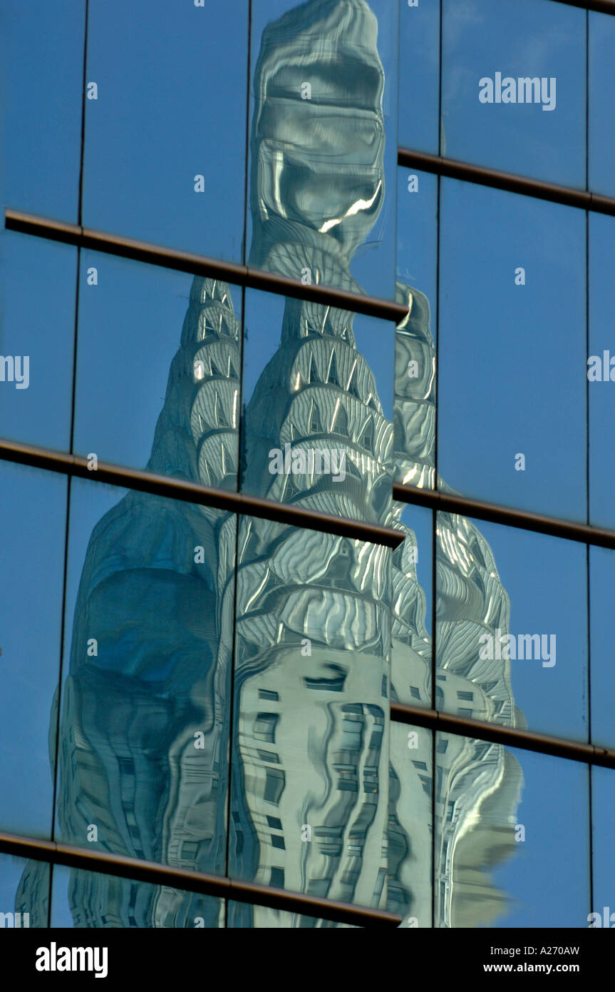 The Chrysler Building skyscraper is reflected in the soaring glass ...