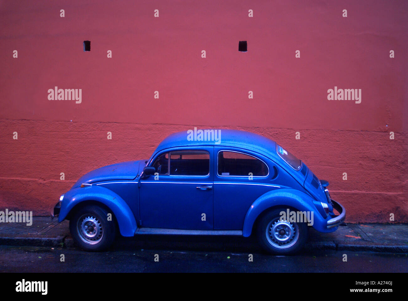 Blue VW Beetle infront of a violet wall Stock Photo - Alamy