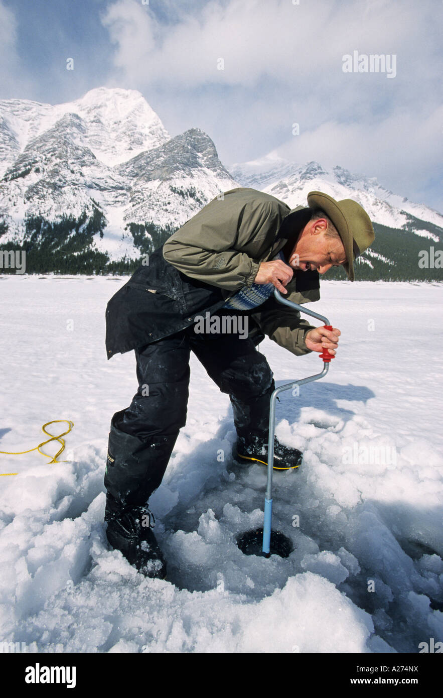 Ice Fishing on the Spray Lake, Banff National Park, Alberta, Canada ...