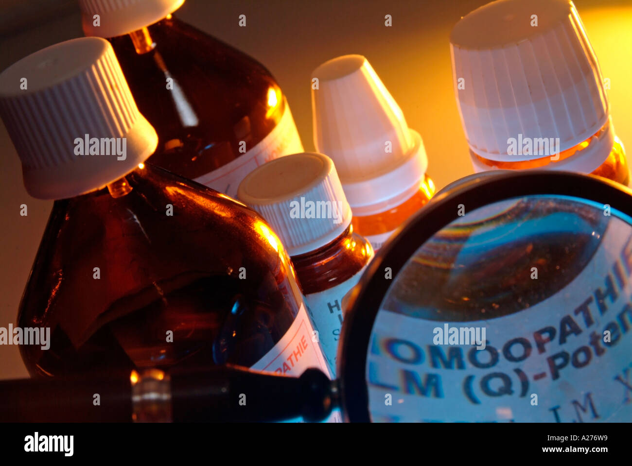 view through a magnifying glass magnifier at a label on bottles with ...